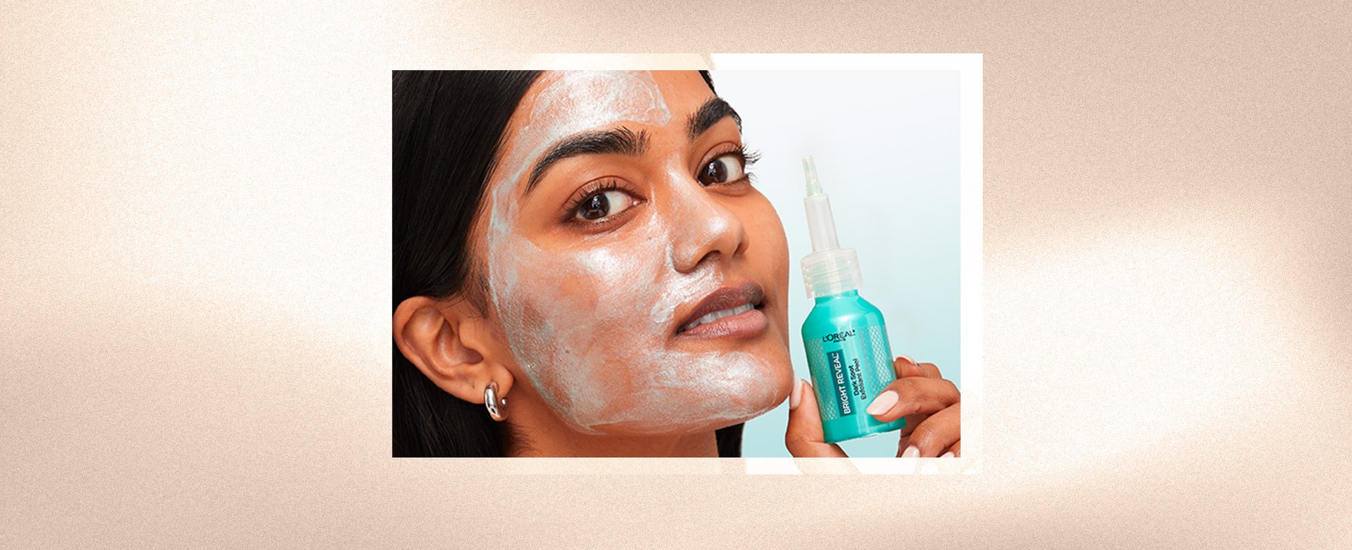 A person applying glycolic acid serum to their face as part of their ...